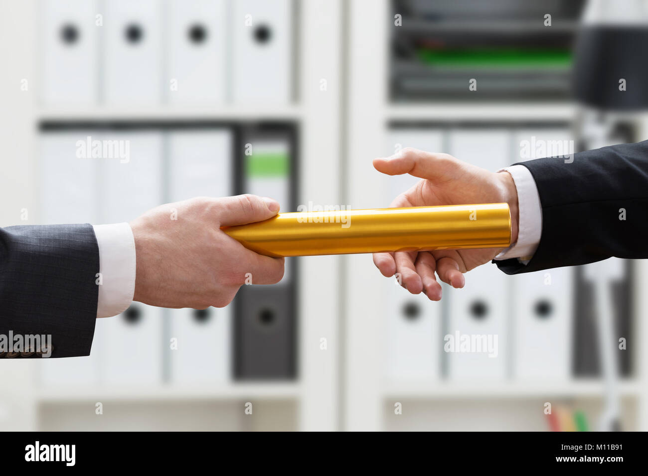 Handover baton in relay race hi-res stock photography and images - Alamy