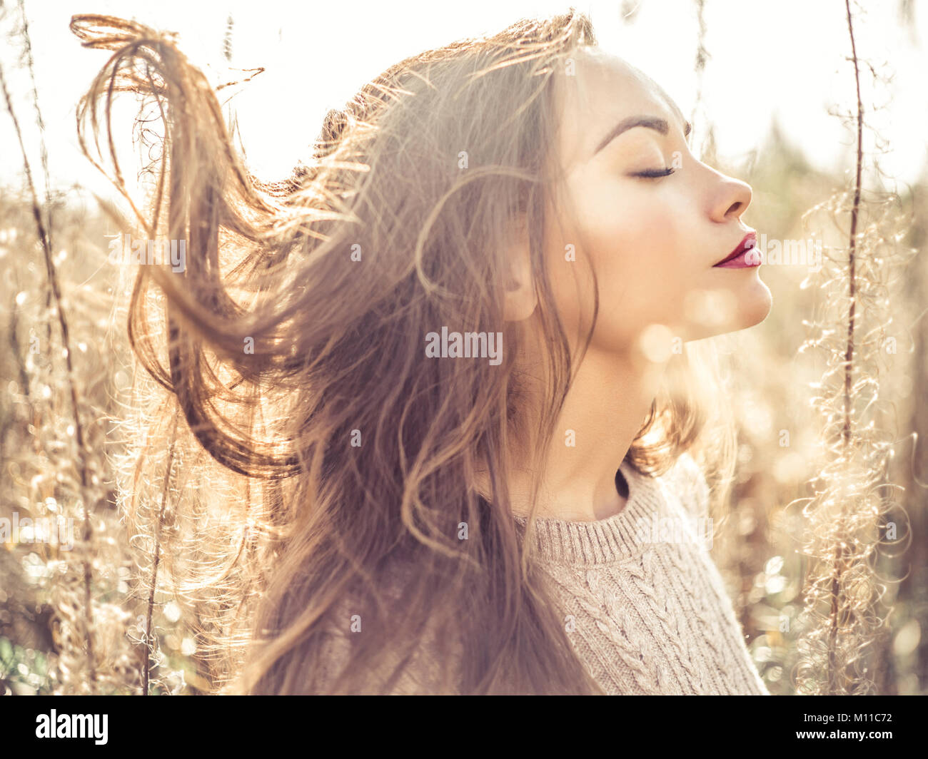 Outdoor fashion photo of young beautiful lady in autumn landscape with ...
