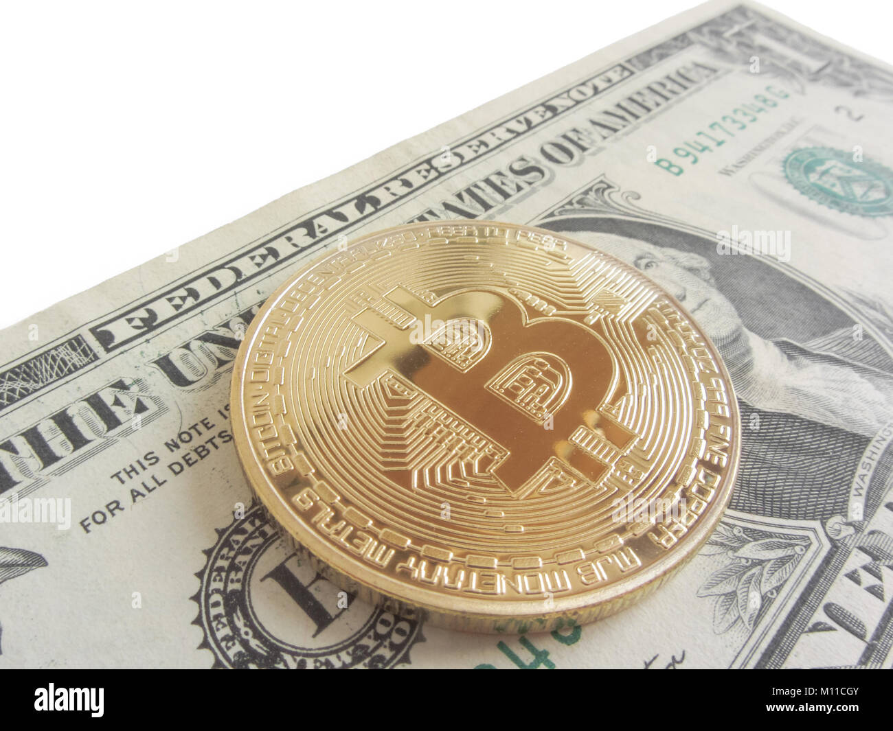 Some Bitcoin and one dollar bill in white background Stock Photo - Alamy