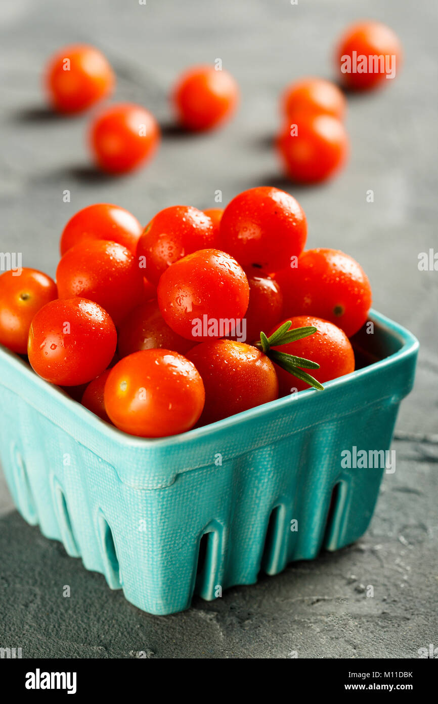 Cherry tomatoes in rustic box Stock Photo - Alamy