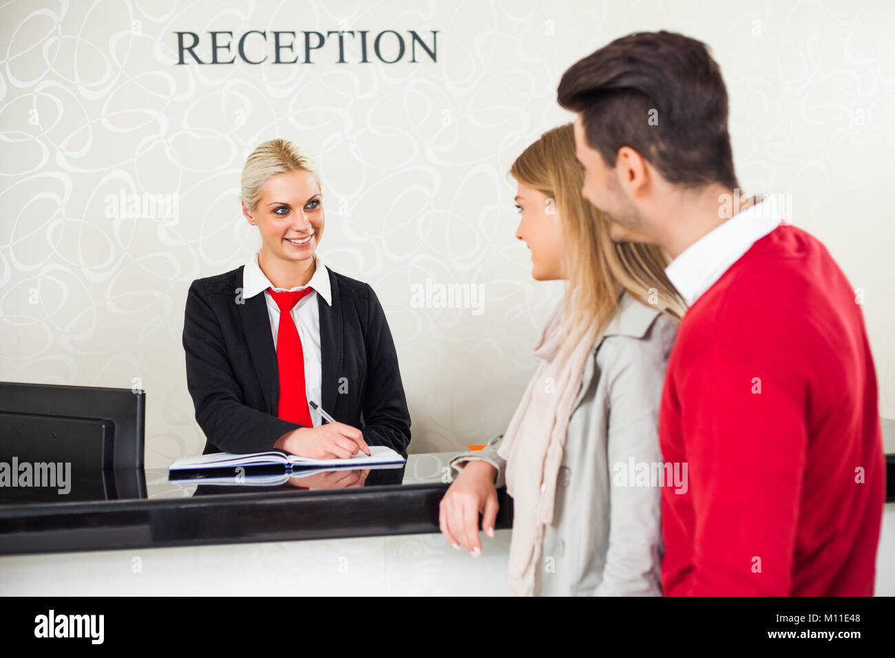 Hotel reception customer manager hi-res stock photography and images ...
