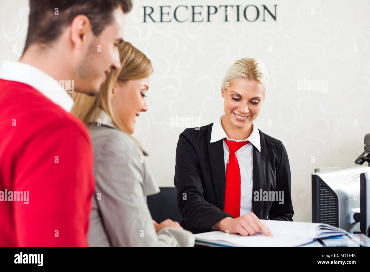 Hotel reception customer manager hi-res stock photography and images ...