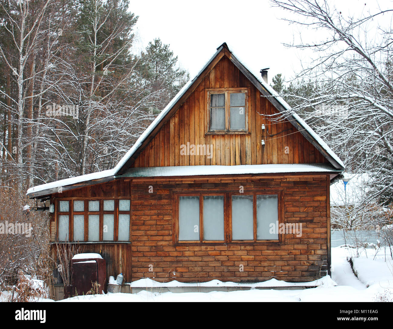 Old rustic wooden house in a snowy forest in winter Stock Photo - Alamy
