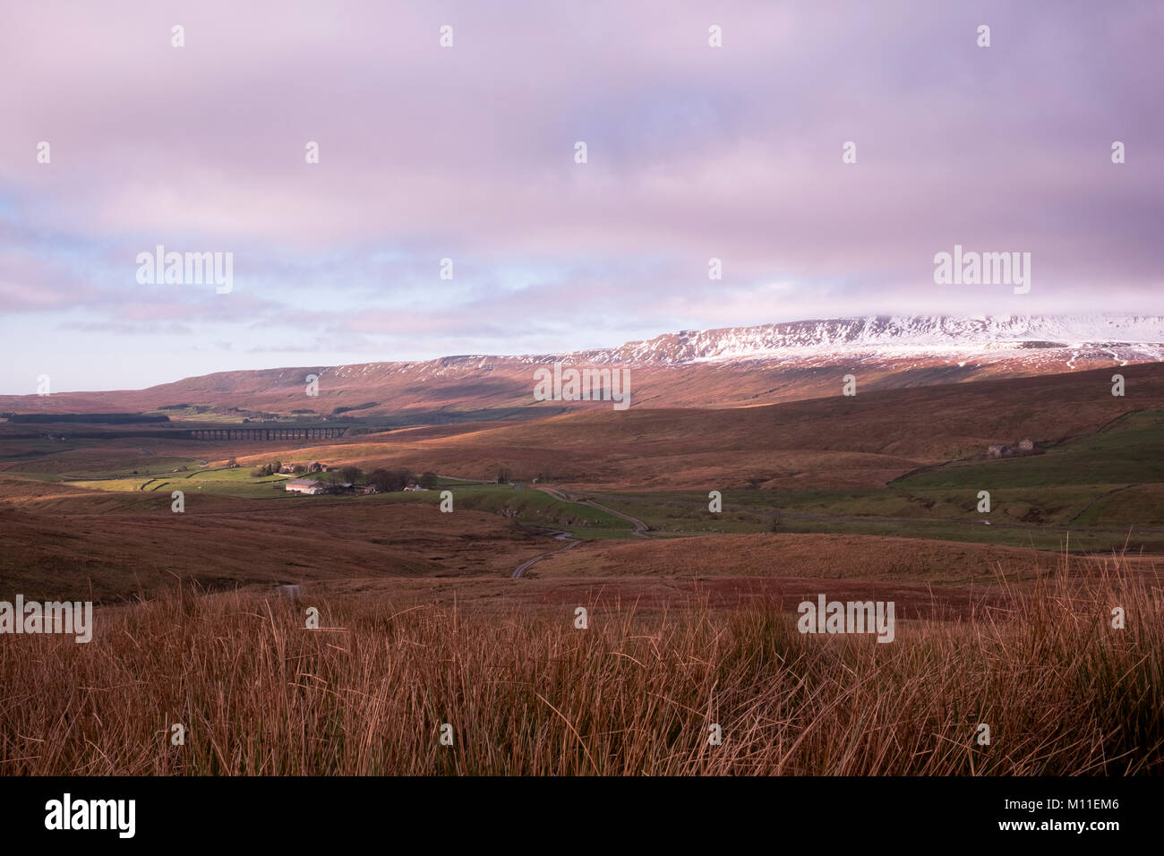 View of snowy Whernside and Ribble viaduct, North Yorkshire, England ...