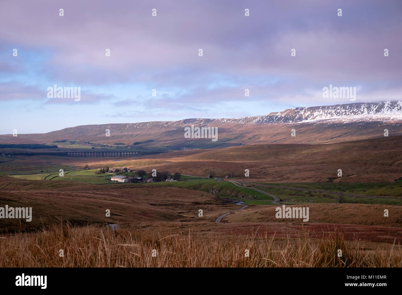 View of snowy Whernside and Ribble viaduct, North Yorkshire, England ...