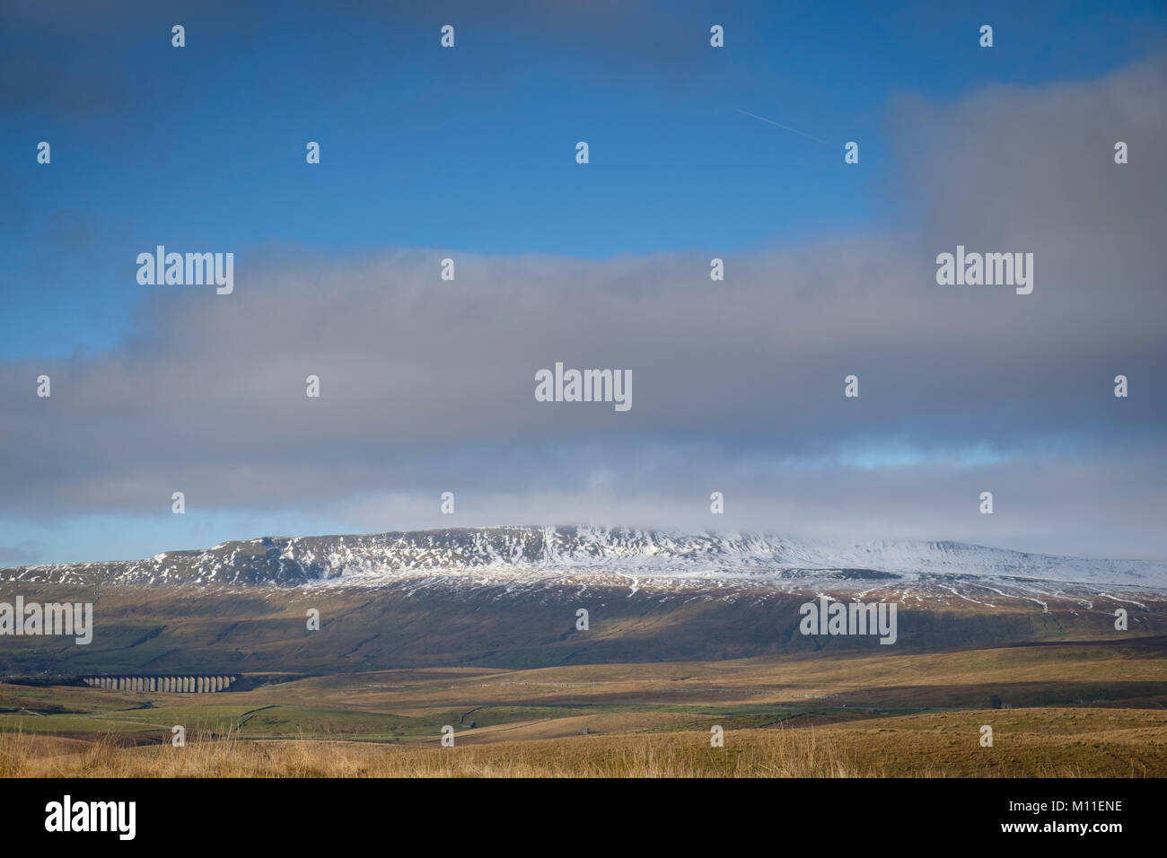 View of snowy Whernside and Ribble viaduct, North Yorkshire, England ...