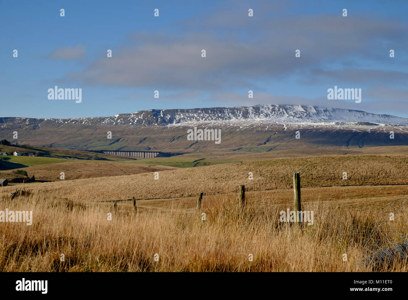 View of snowy Whernside and Ribble viaduct, North Yorkshire, England ...