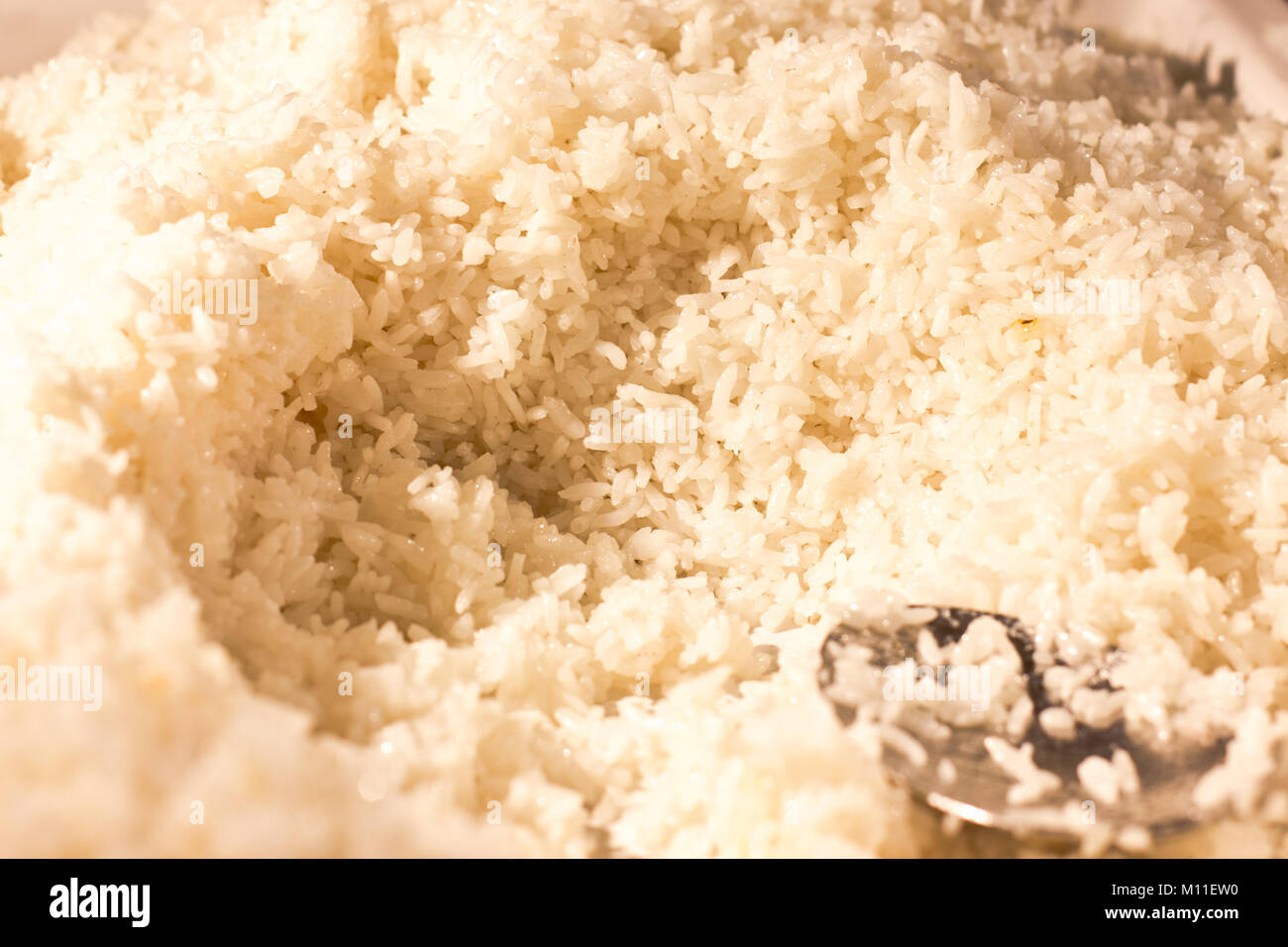 White long boiled rice with a silver spatula Stock Photo - Alamy