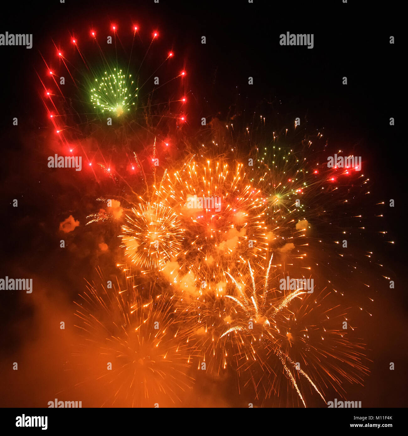 red colorful fireworks on the black background Stock Photo - Alamy