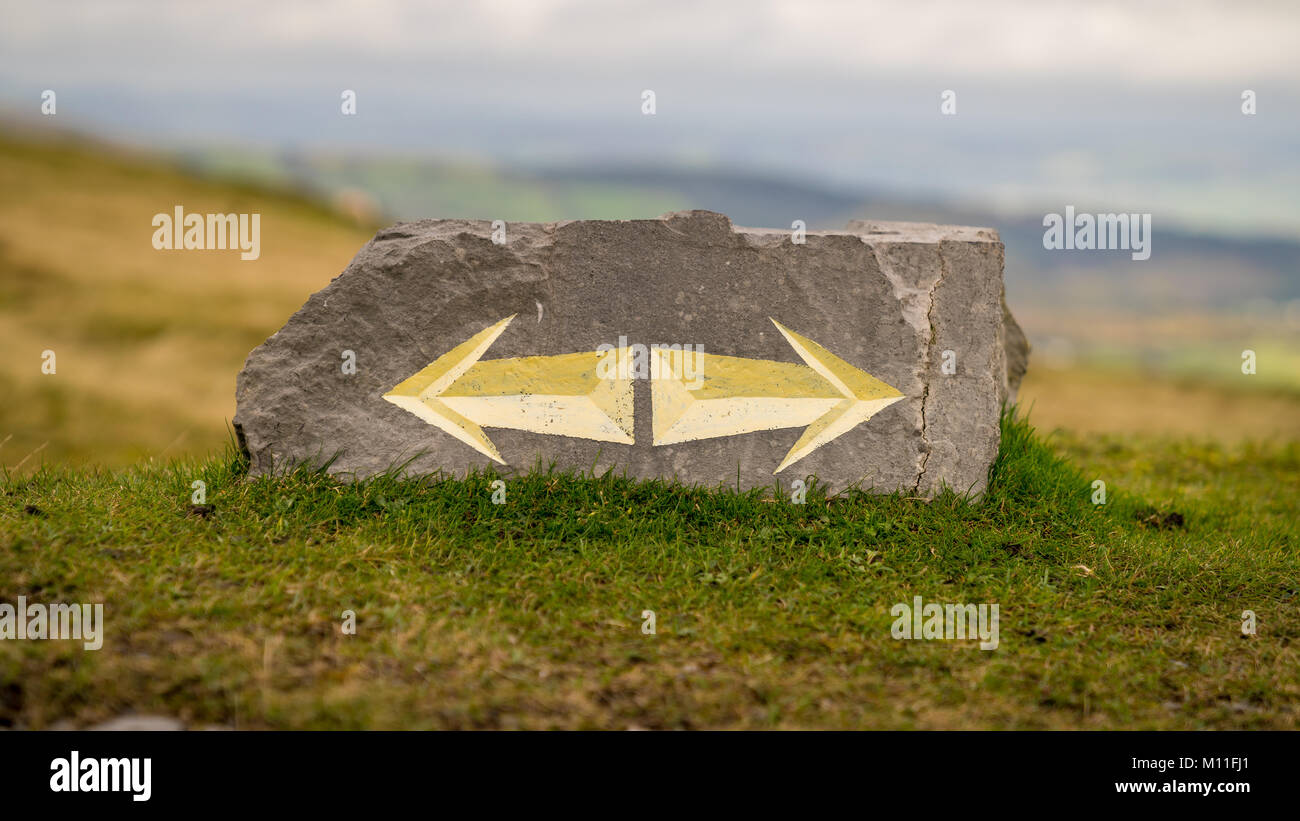 Directional arrow carved in a stone, seen at the Black Mountain ...