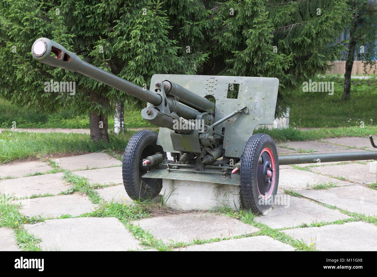Artillery gun ZIS-3 in the square near the monument to fallen soldiers ...