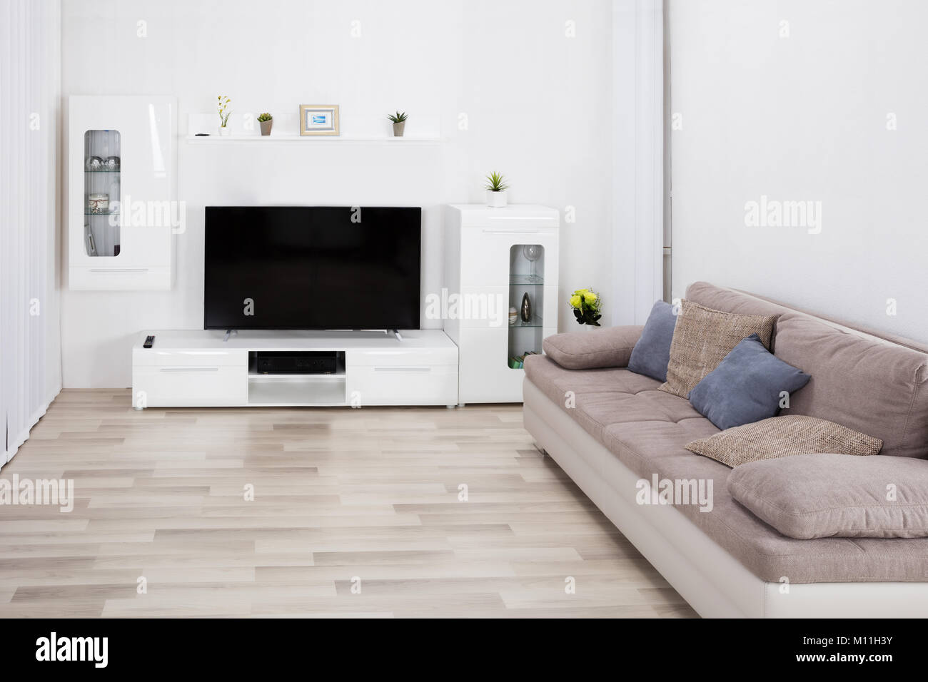 Interior Of Living Room With Couch And Television Stock Photo - Alamy