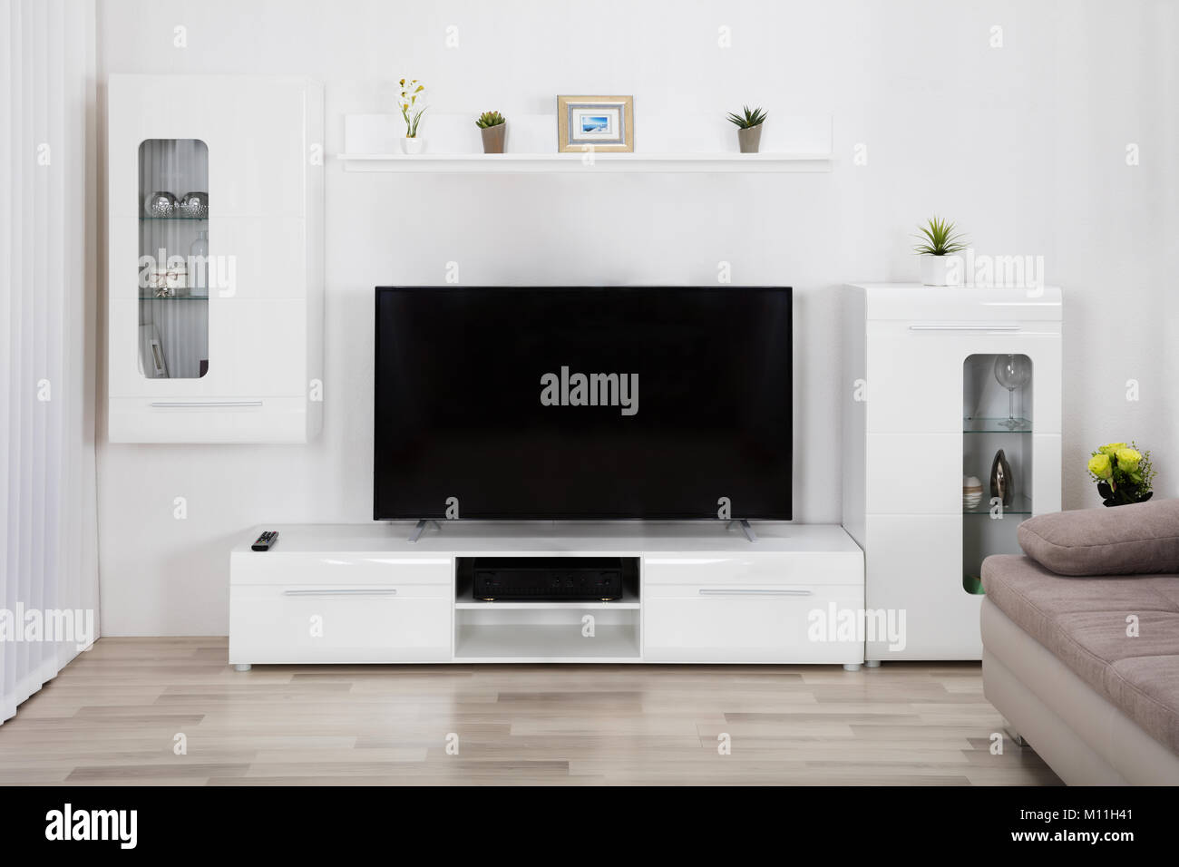 Interior Of Living Room With Couch And Television Stock Photo - Alamy
