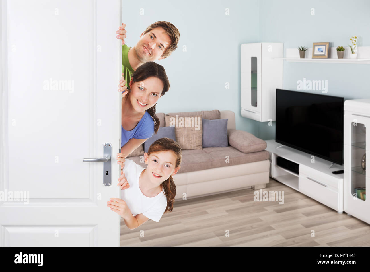 Man peeking door hi-res stock photography and images - Alamy