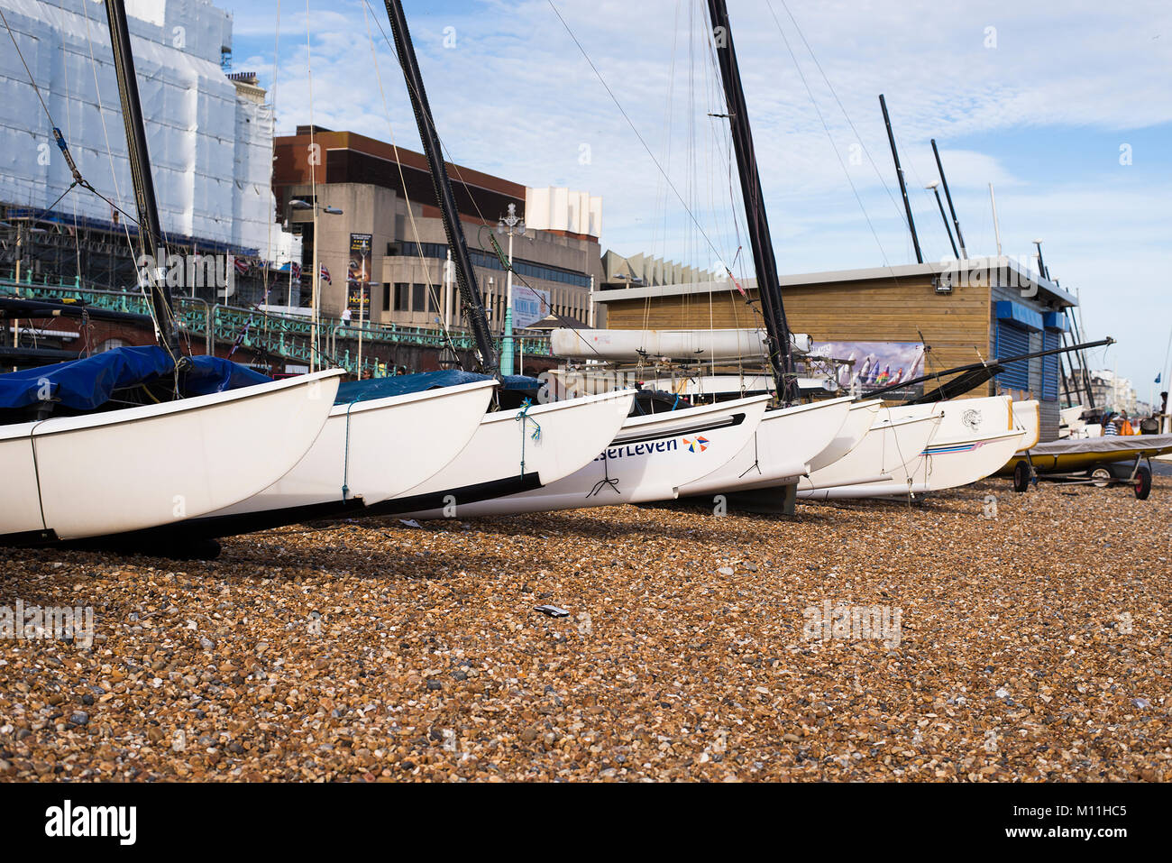 Sailing boats on Brighton beach Stock Photo - Alamy