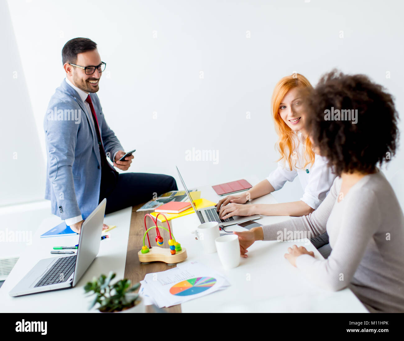 business people around table during staff meeting in the office Stock ...