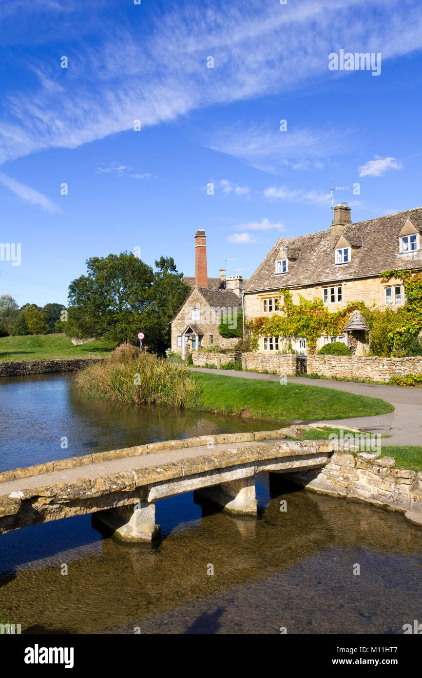 The idyllic Cotswold stone riverside cottages of Lower Slaughter in ...