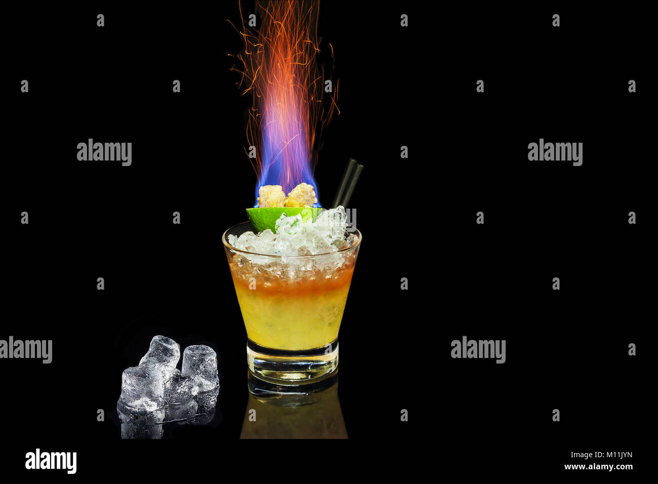 alcohol cocktail with fire and sparks on a black background Stock Photo ...