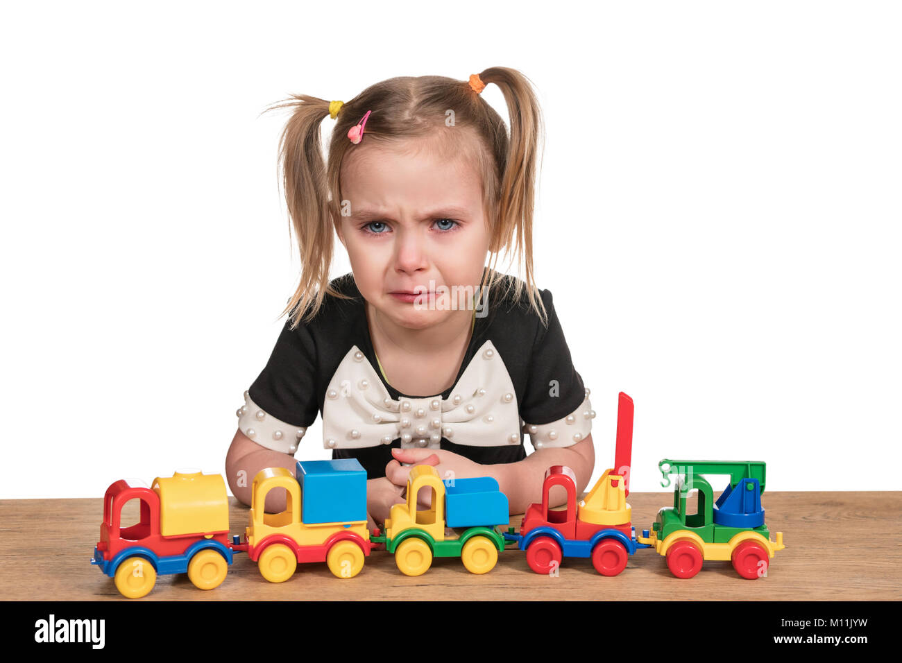 Child cries while playing Stock Photo - Alamy