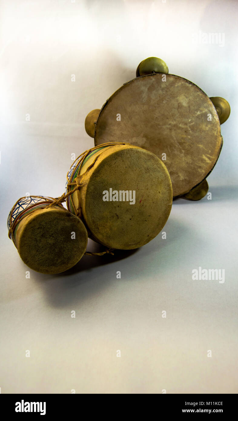 Ethnic instruments: drums and tambourine isolated on white background ...