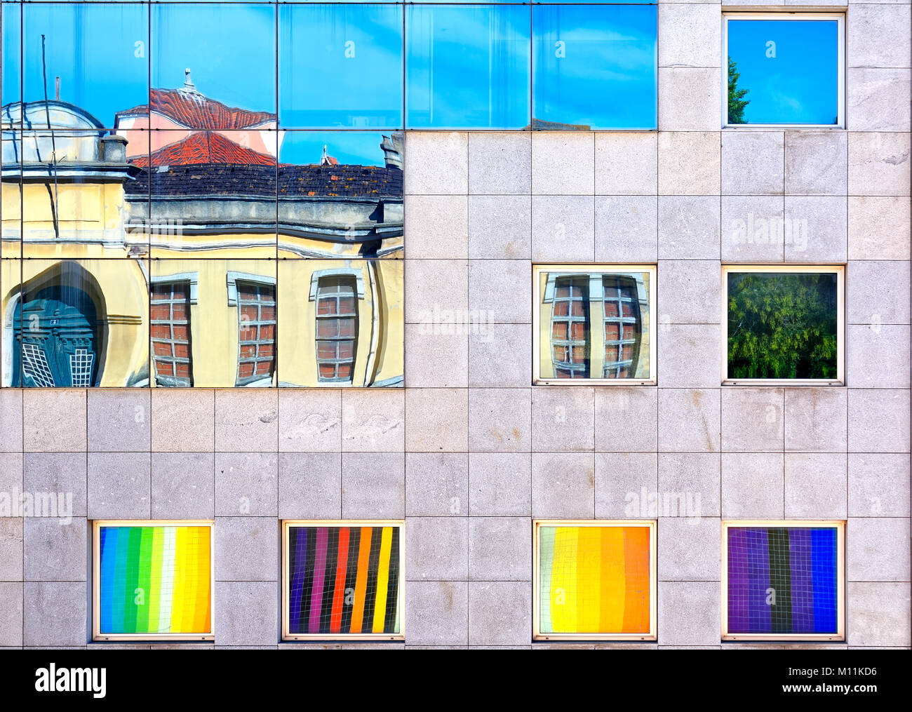 facade of building with reflections of the windows of very colorful ...