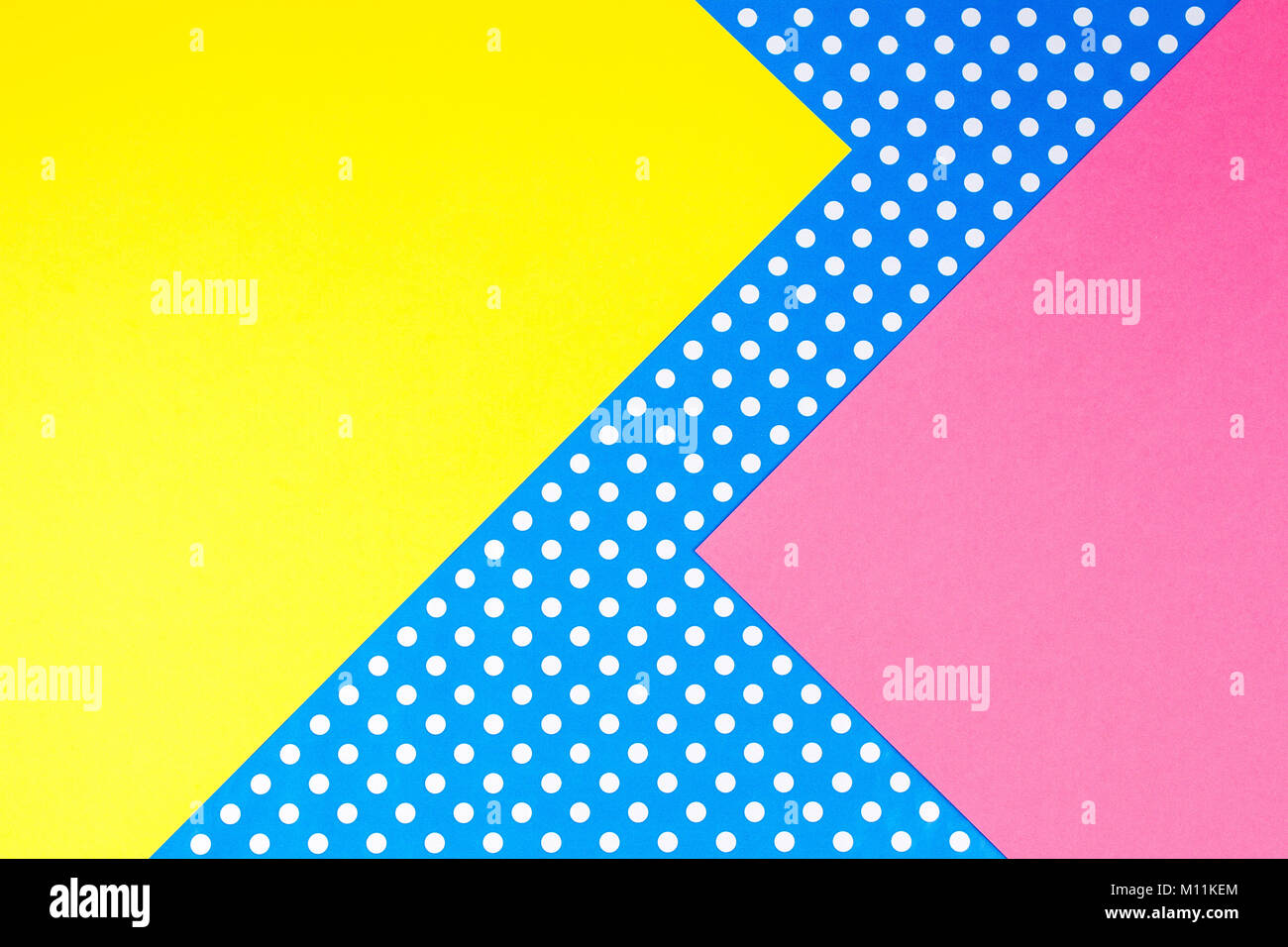 Abstract geometric yellow, pink and blue polka dot paper background ...