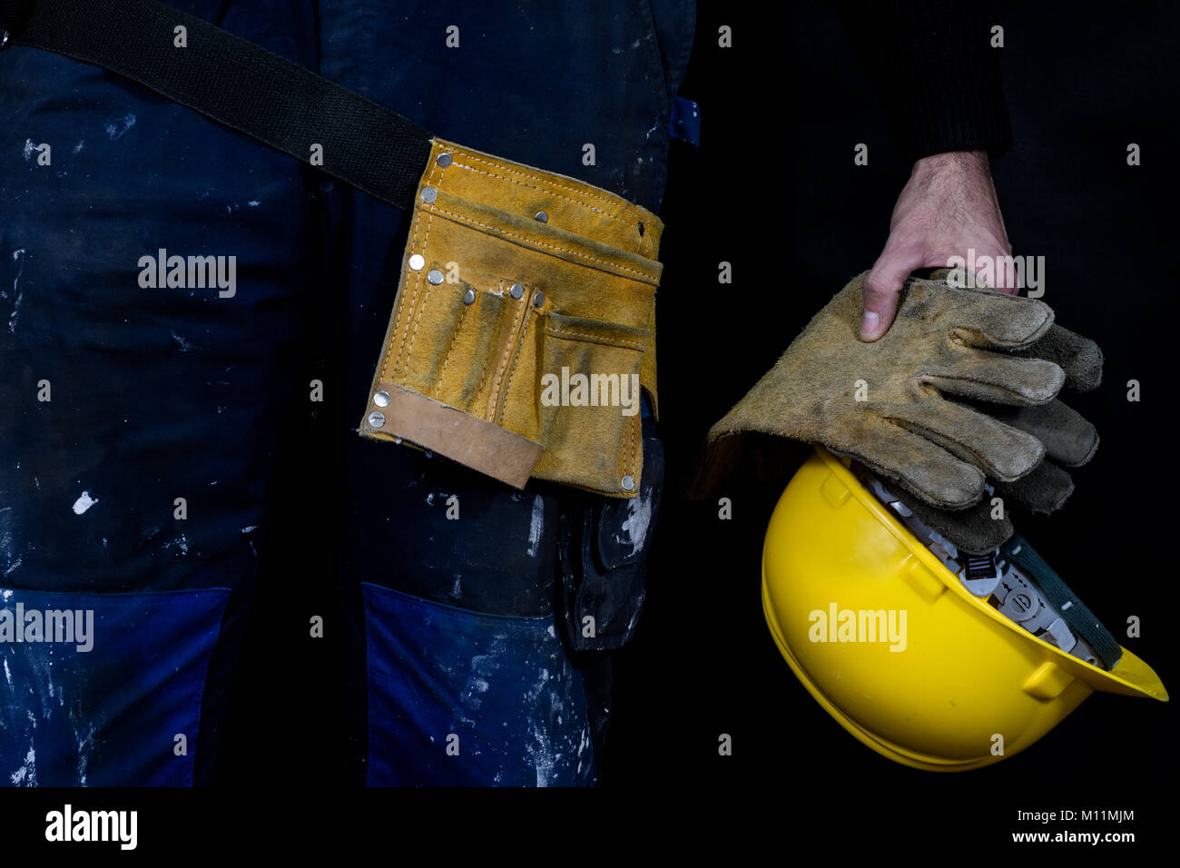 Workwear for production workers. A construction worker holding ...