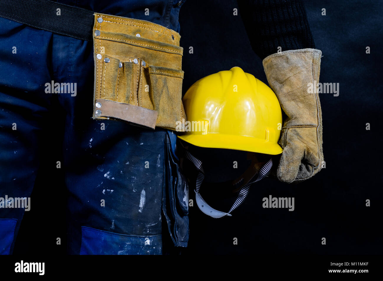 Workwear for production workers. A construction worker holding ...