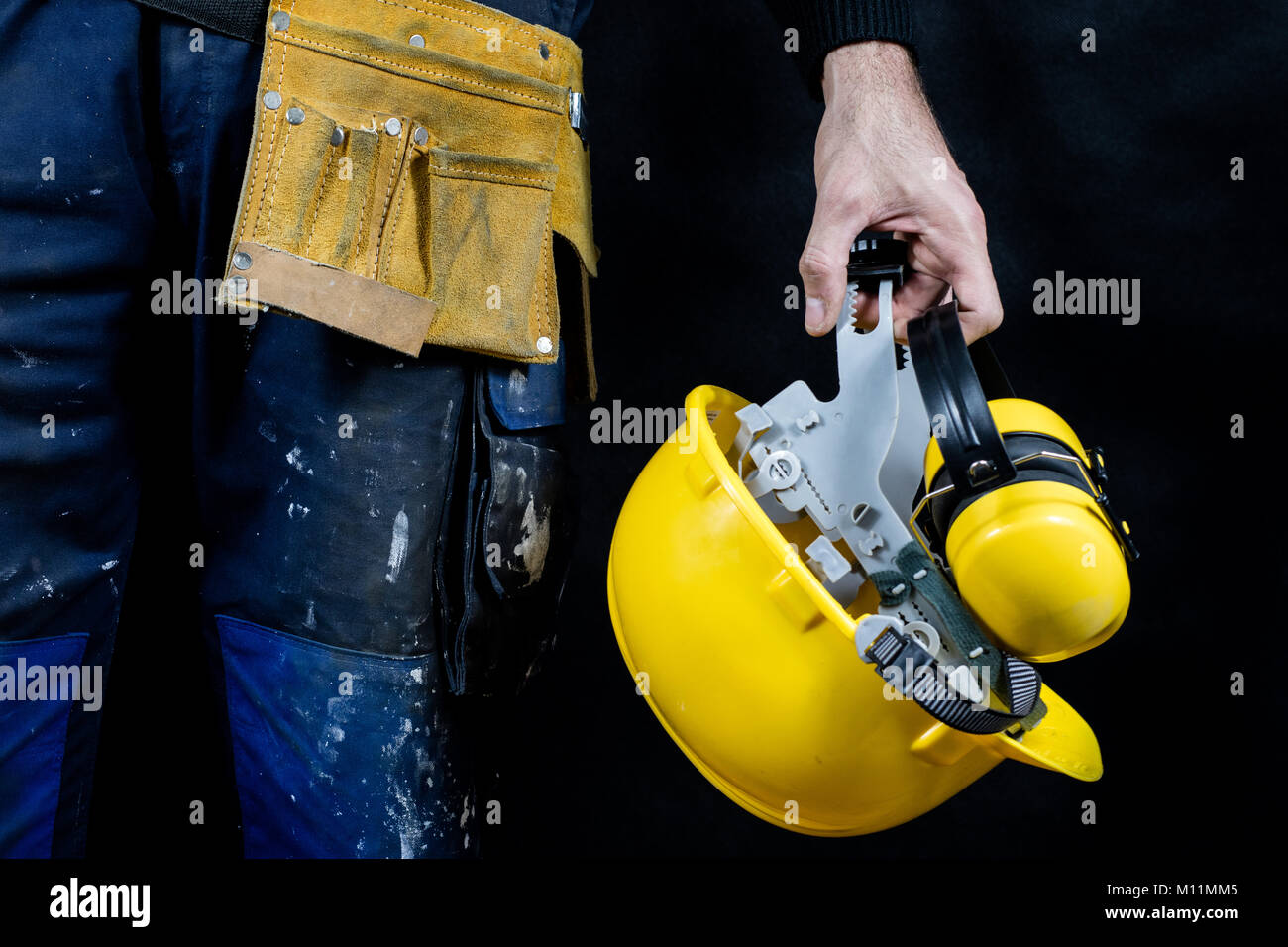 Workwear for production workers. A construction worker holding ...
