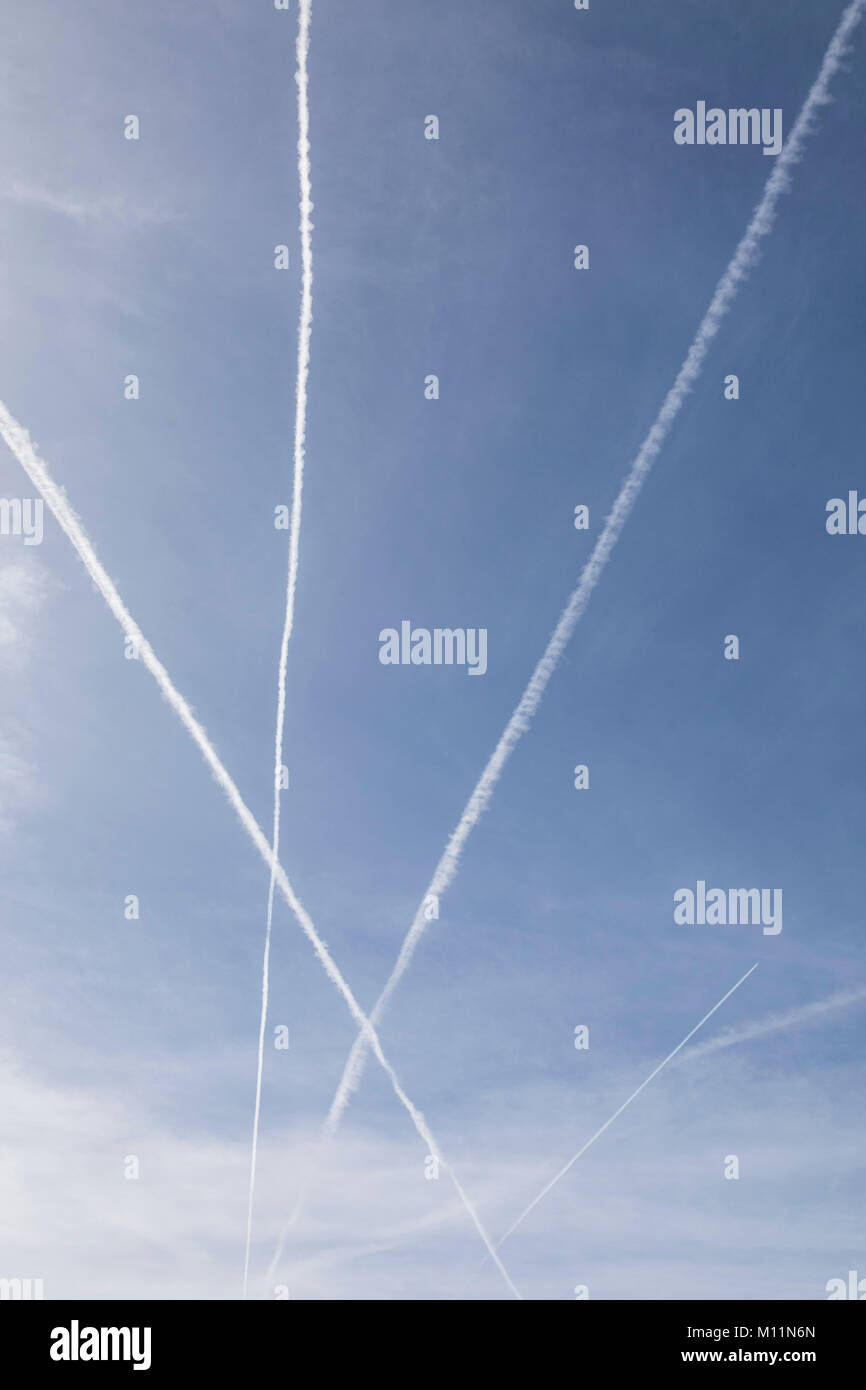 Contrails in the sky over the North Sea island Norderney, Germany ...