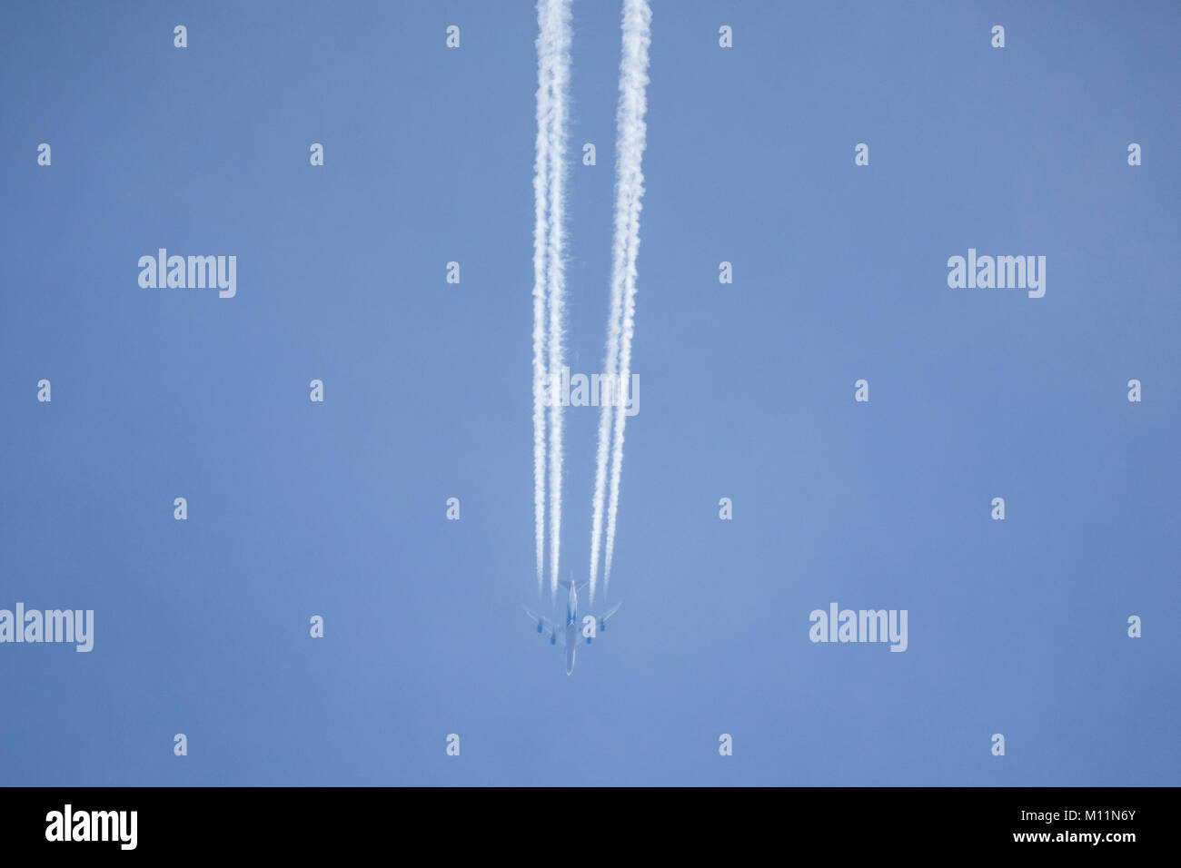 Contrails in the sky over the North Sea island Norderney, Germany ...