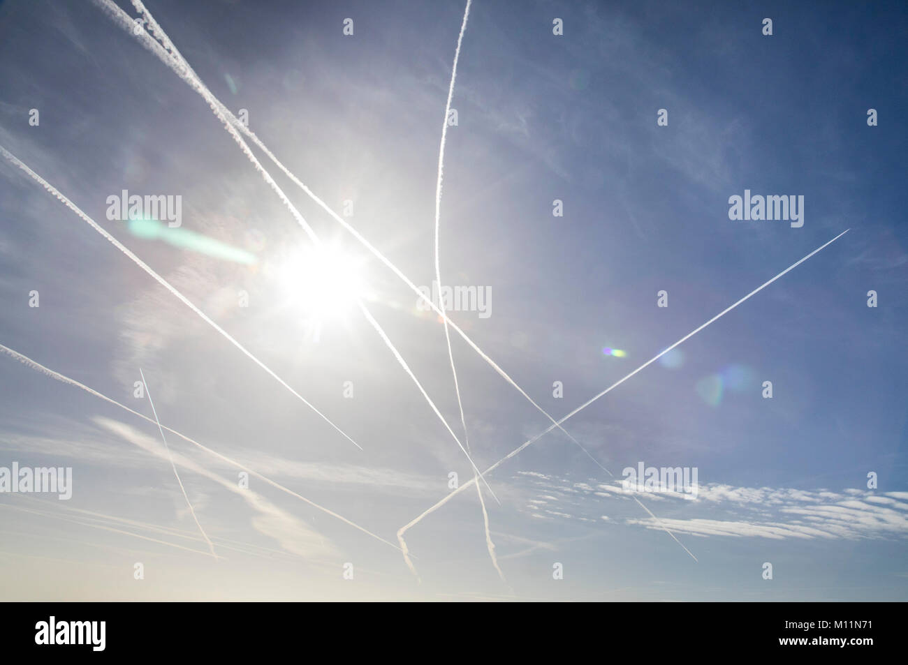 Contrails in the sky over the North Sea island Norderney, Germany ...