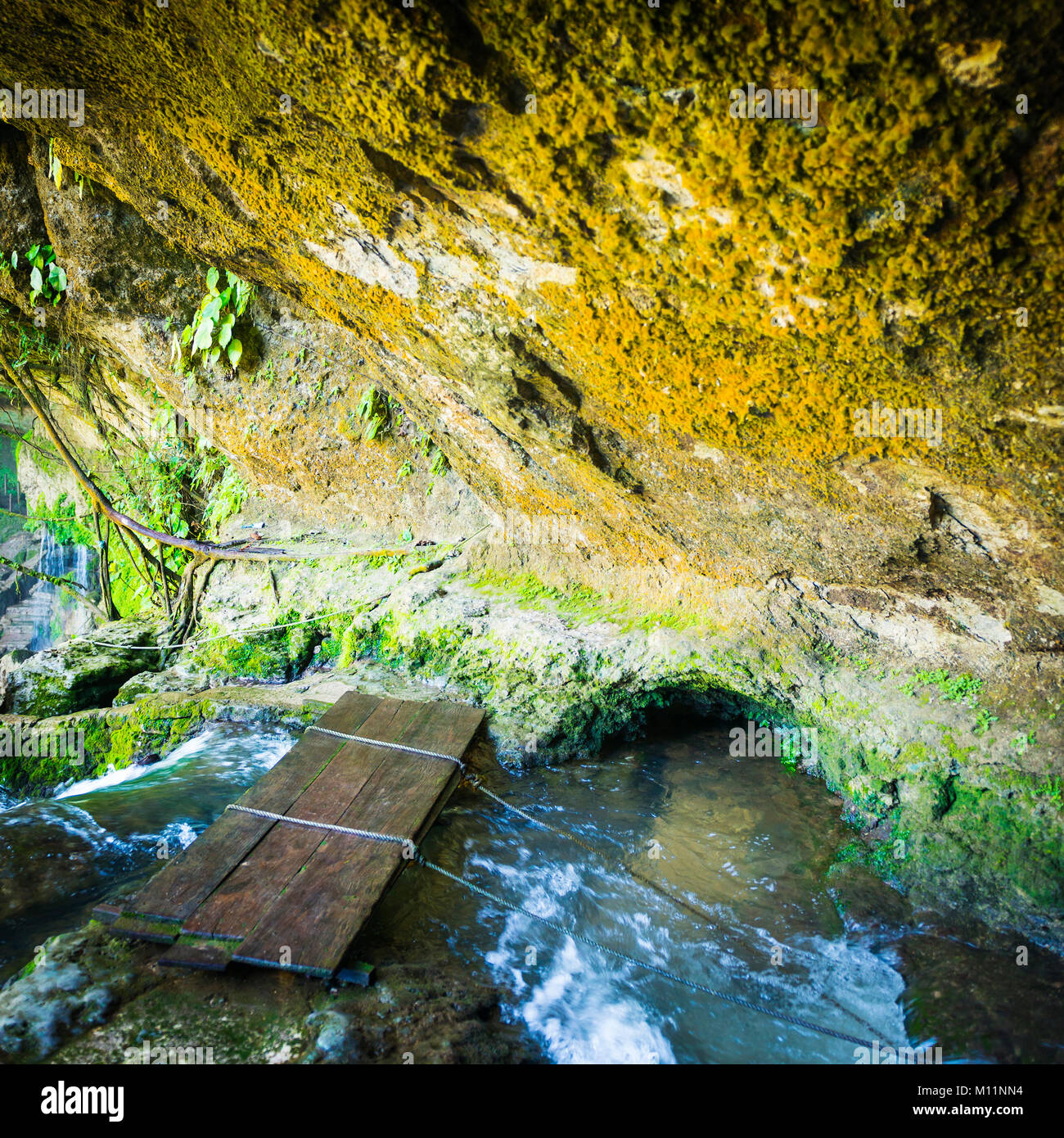 Cave bridge over river at Misol Ha Waterfall near Palenque in Chiapas ...