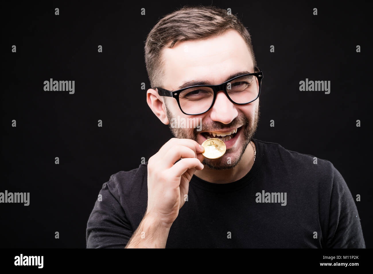 Black man biting golden hi-res stock photography and images - Alamy