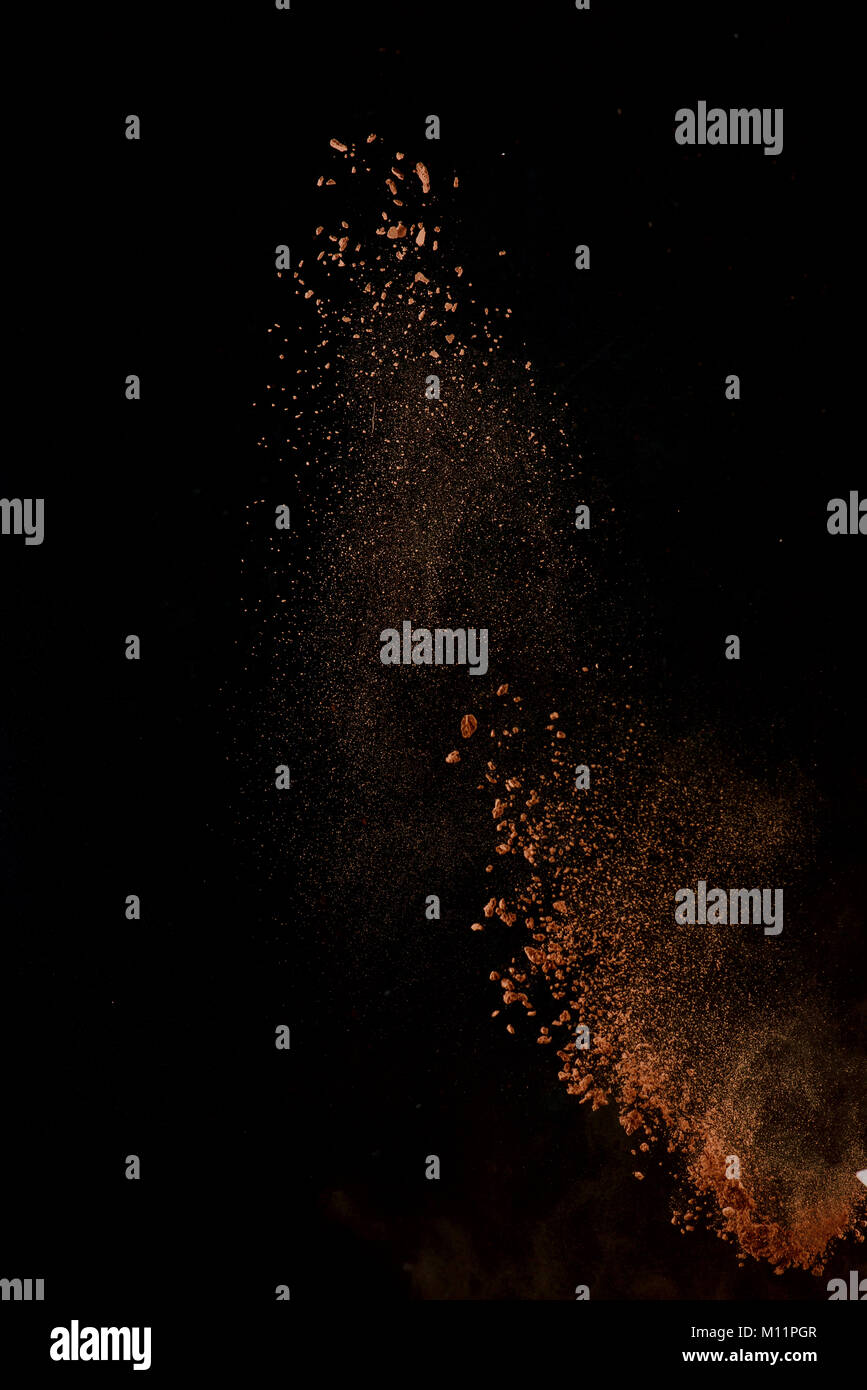 Cocoa powder explosion in motion hi-res stock photography and images ...