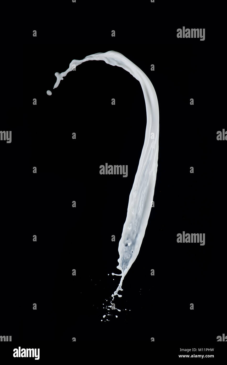 Twisted milk splash isolated on a black background. Liquid high speed ...