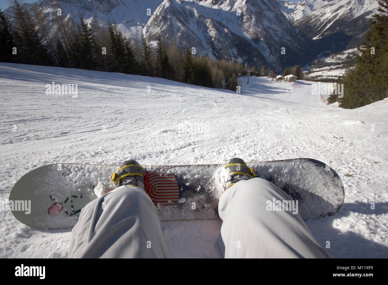 a view of the piste with snowboard in the foreground in the Italian ...
