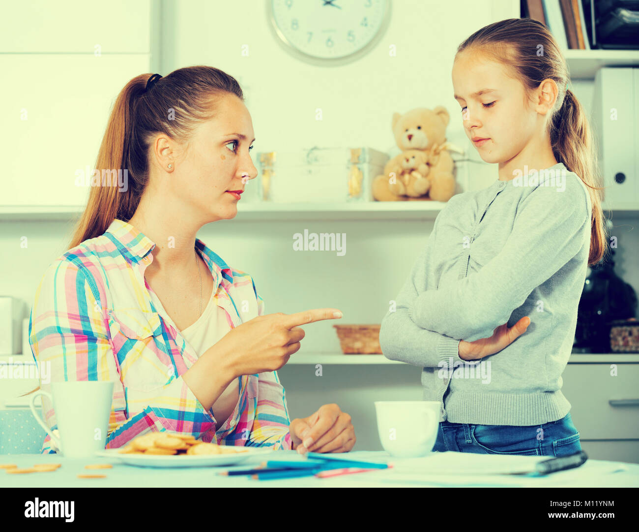 Young mother scolding her daughter for bad behavior and mistakes Stock Photo - Alamy