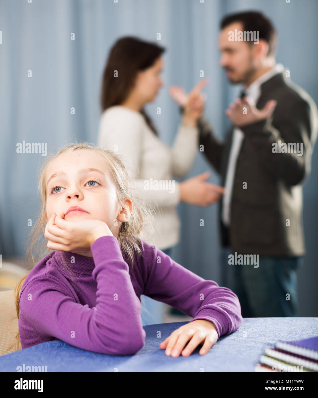 Father and mother having disagreement while their child at home Stock ...