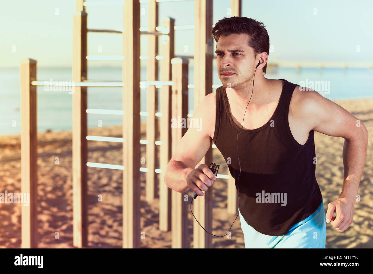 Man jogging on beach during hi-res stock photography and images - Alamy