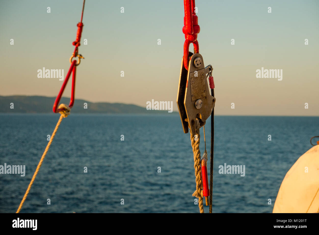 ropes on a ferry with the sea in the background Stock Photo - Alamy