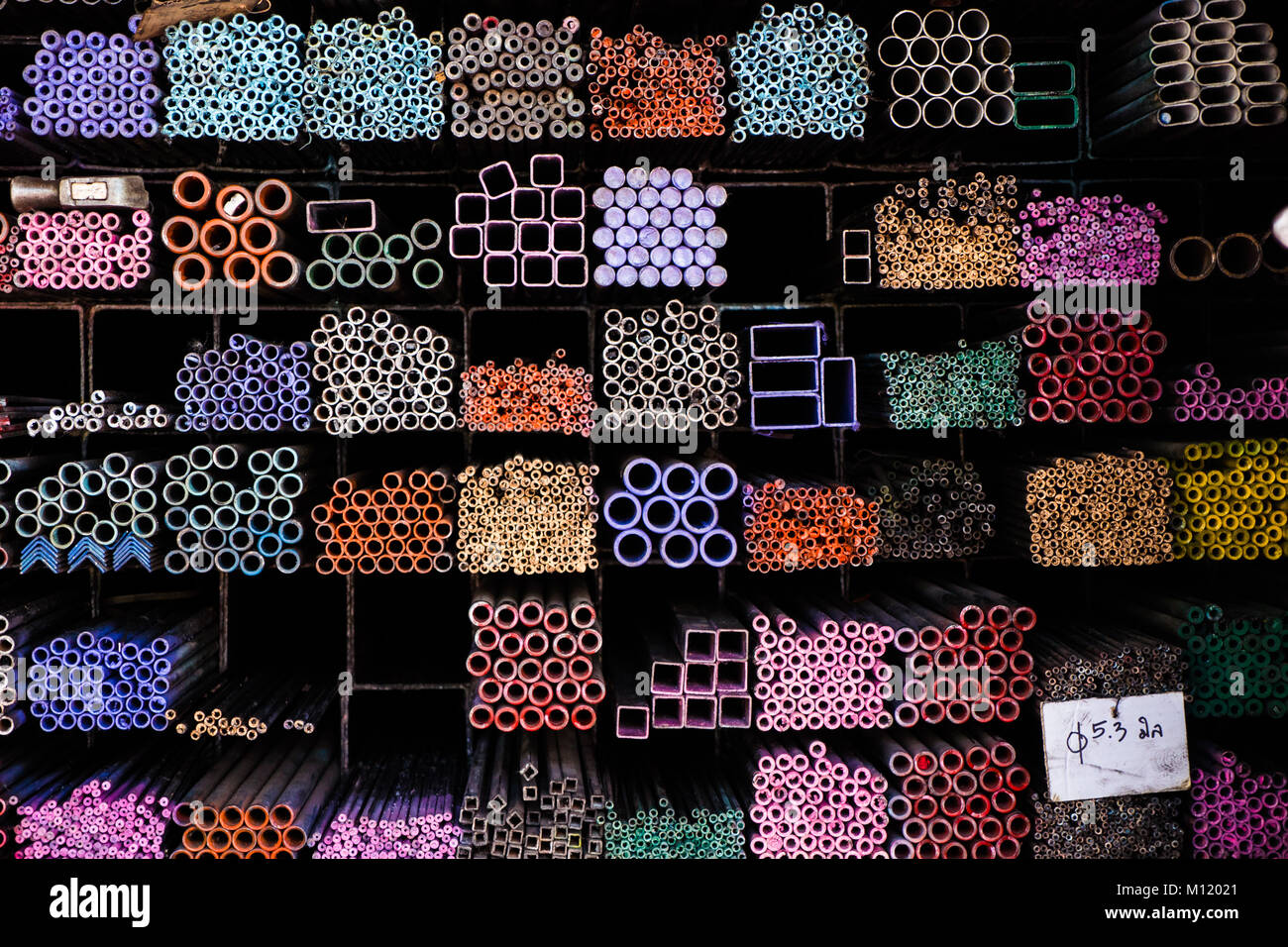 Shelf filled with different kind of colorful pipes Stock Photo - Alamy
