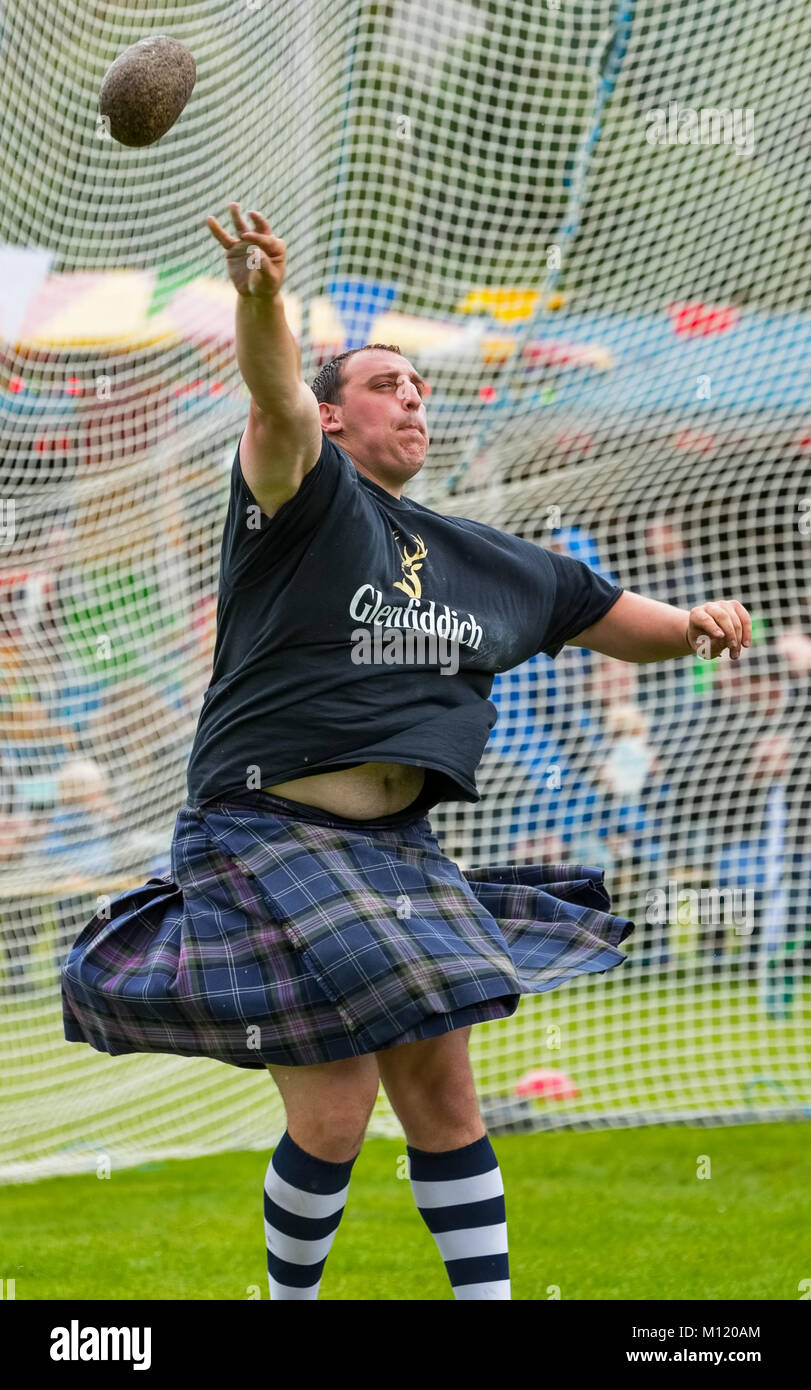 Kyle Randall from Grangemouth throwing the light stone Stock Photo - Alamy