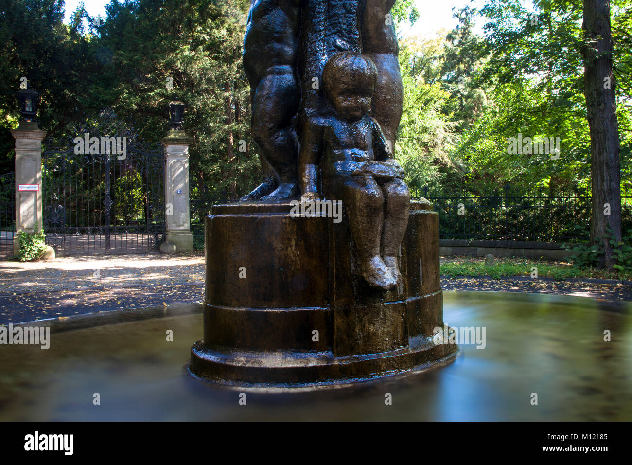 Germany, Cologne, fountain with putti in front of the main entrance of ...