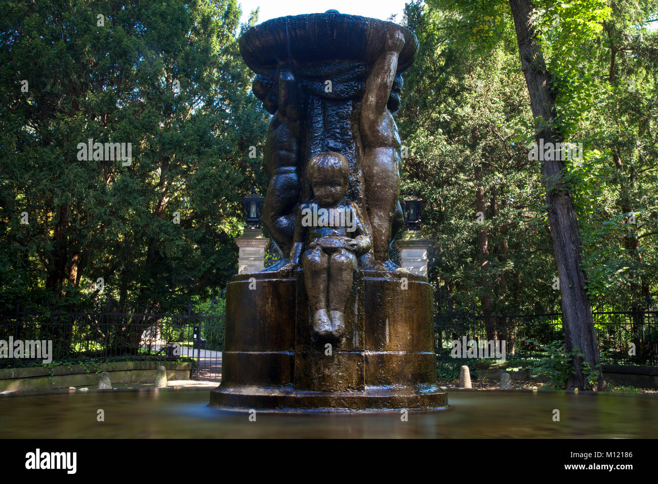 Germany, Cologne, fountain with putti in front of the main entrance of ...