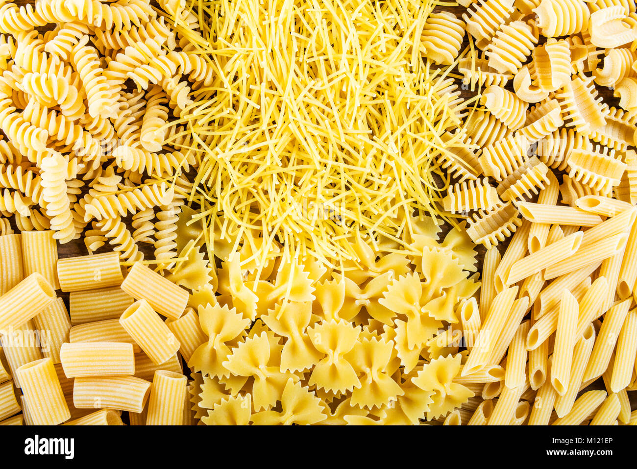 Different Types of Raw Pastas such as Fusilli, Penne Rigate, Radiatori ...