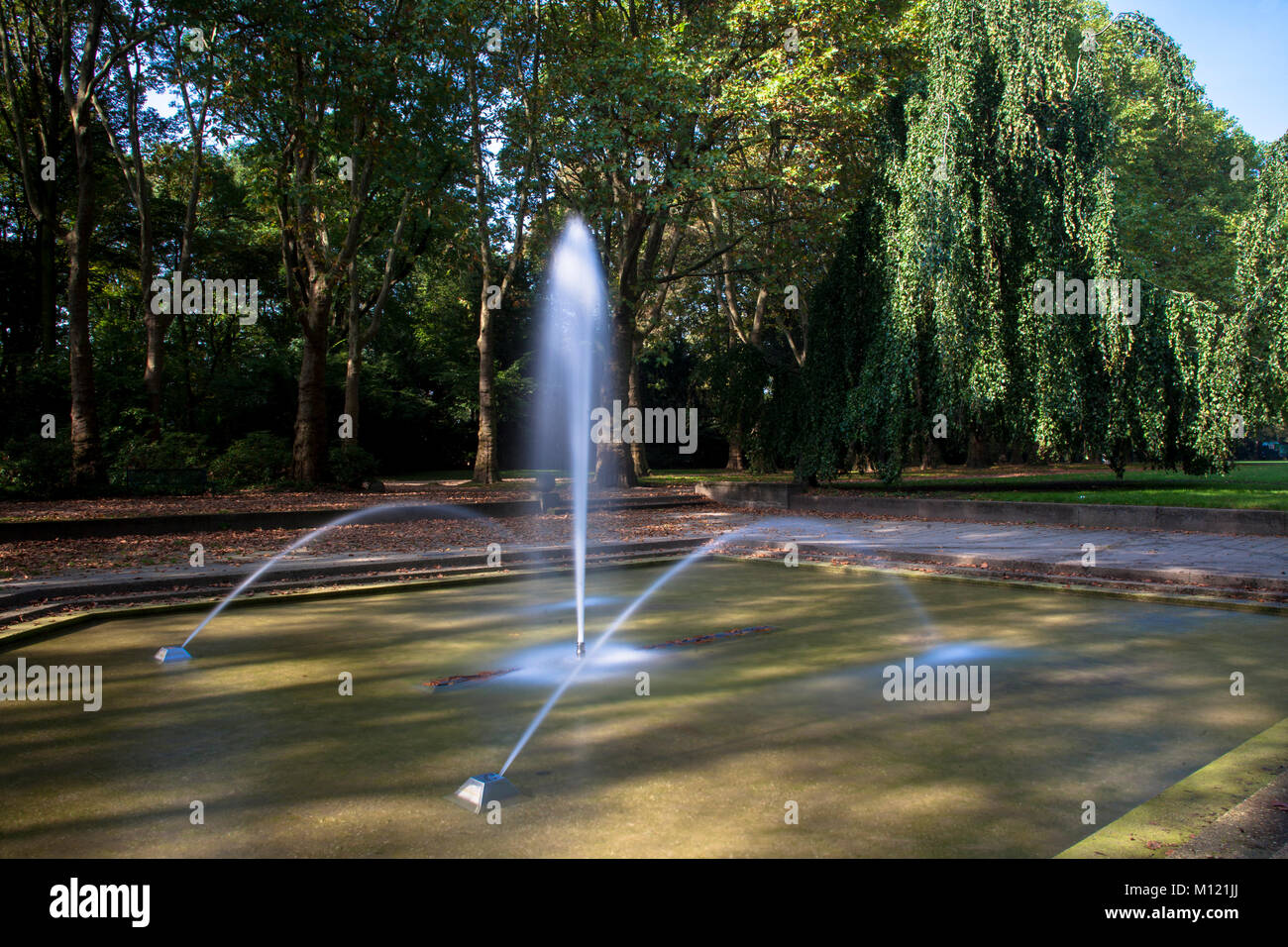 Germany, Cologne, fountain at the Bluecher park in the town districts ...