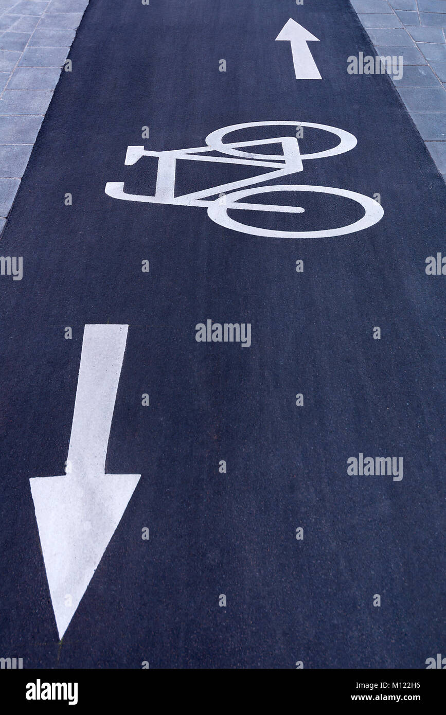 Bicycle path with white markings,bicycle and direction arrows,Bavaria ...