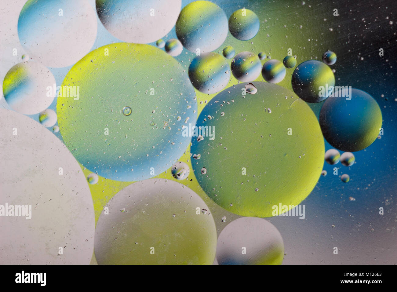 Abstract image with colorful circles and shapeless bodies on a colored ...