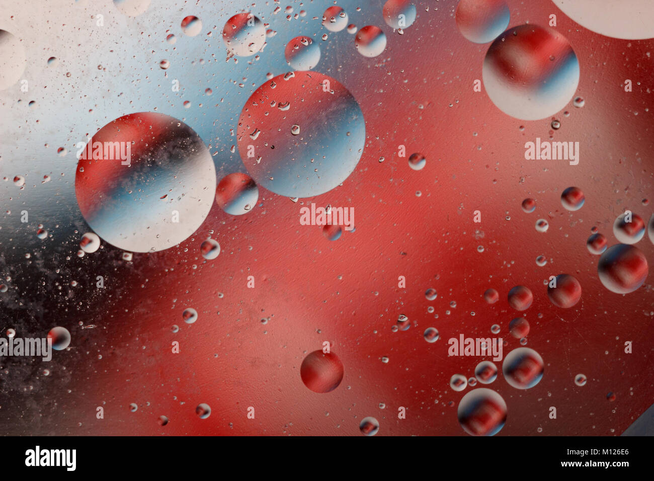 Abstract image with colorful circles and shapeless bodies on a colored ...